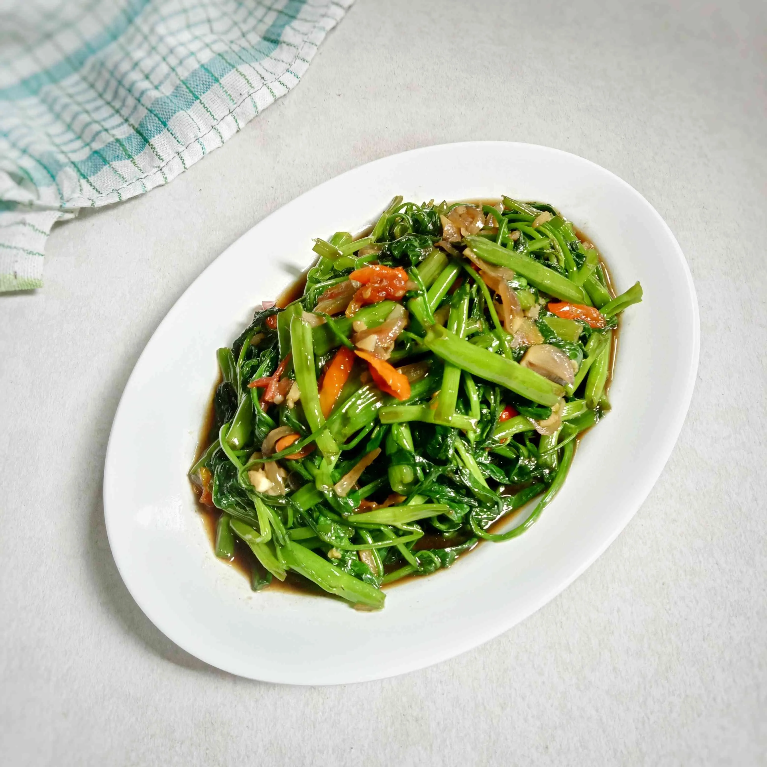 Resep Cah Kangkung Terasi ala Resto Sederhana Rumahan di Yummy App Resep Cah Kangkung Terasi ala Resto Sederhana Rumahan di Yummy App